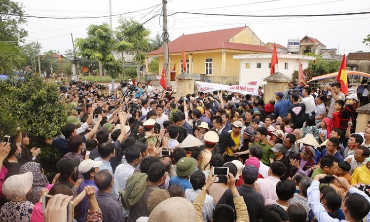 Hanoi police probe 22 protesters in Dong Tam deadly riot