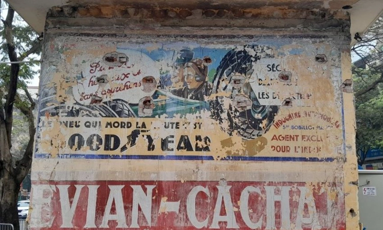 Colonial-era French ad posters preserved on Hanoi street